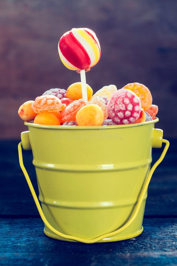 Candy Time. Beautiful Young Women Holding a Plate Full of Candies while ...