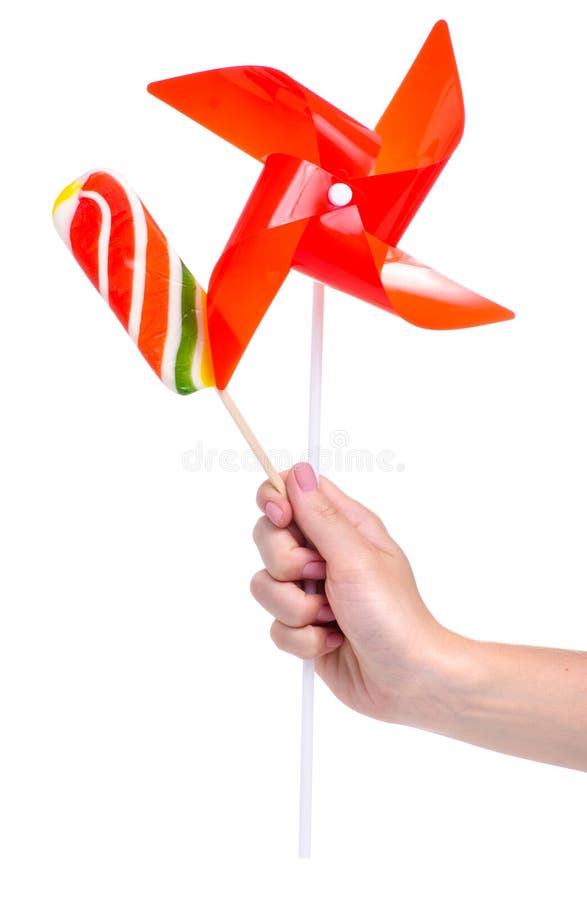 Candy and Toy Windmill in Hand Stock Photo - Image of holiday, mollusk ...
