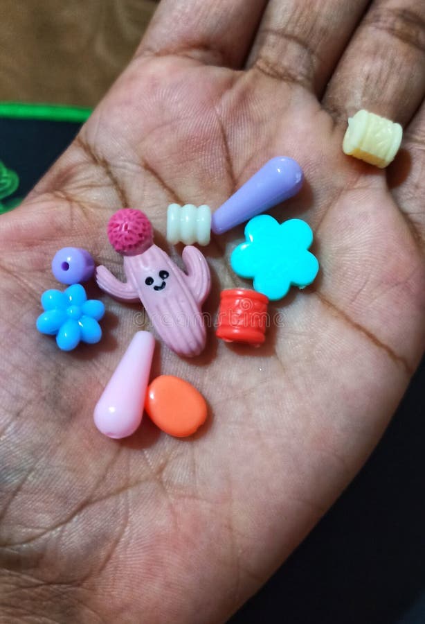 Candy toys on my hand stock image. Image of violet, pink - 242738615