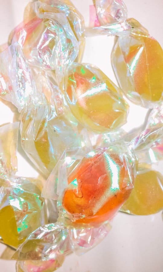 Candy Wrapped in Holographic Plastic Stock Photo - Image of treats ...