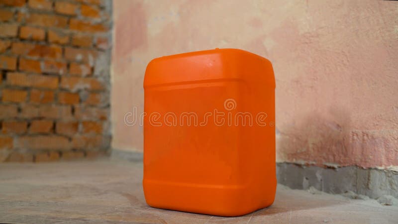Canisters with Primer on a Construction Site. a Bright Orange Container ...