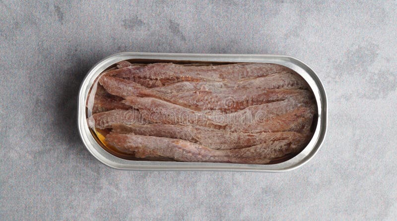 Canned Anchovy Fillets on Light Gray Table, Top View Stock Photo ...
