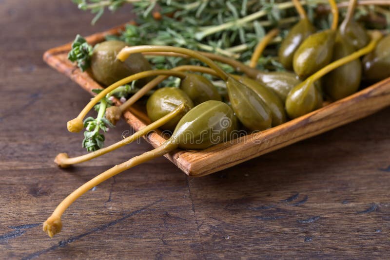 Canned capers with thyme stock photo. Image of closeup - 246469844