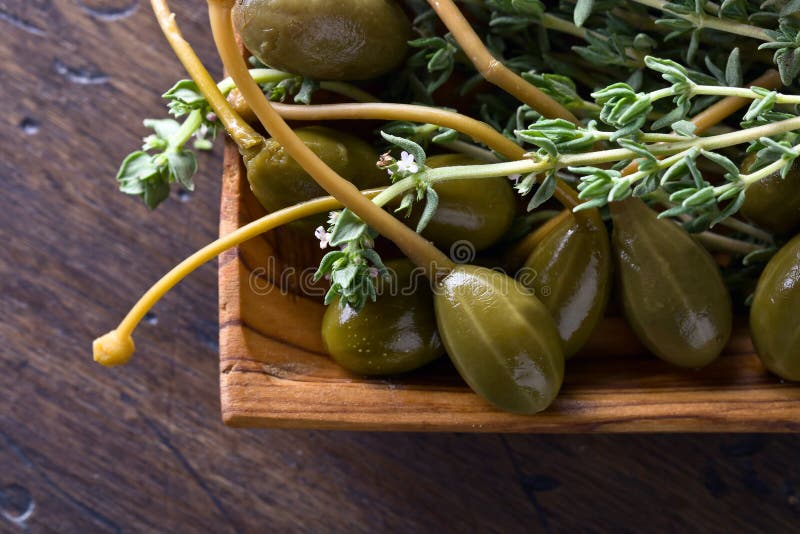 Canned capers with thyme stock photo. Image of closeup - 246469844