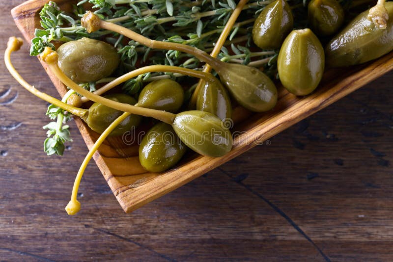 Canned capers with thyme stock photo. Image of closeup - 246469844