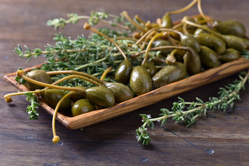 Canned capers with thyme stock photo. Image of closeup - 246469844