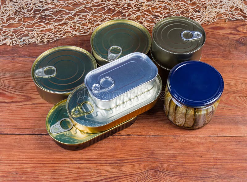 Canned Fish in Different Sealed Tin Cans and Glass Jar Stock Photo ...