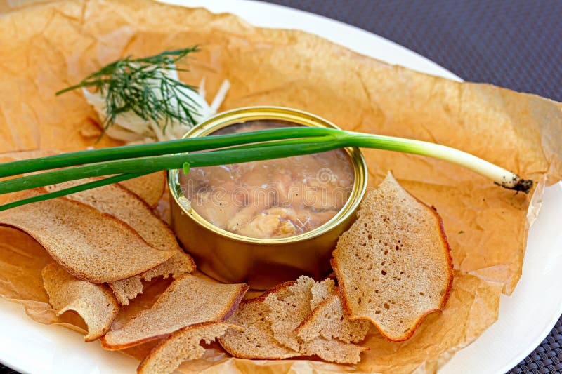 Canned Fish in an Iron Jar with Green Onions and Chips Stock Image ...