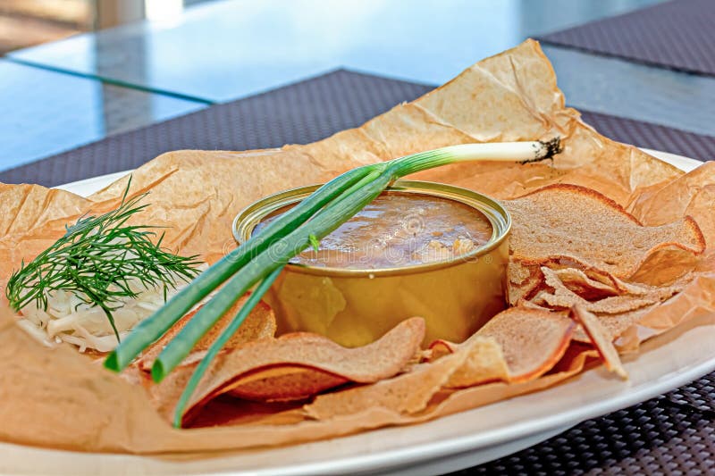 Canned Fish in an Iron Jar with Green Onions and Chips Stock Image ...