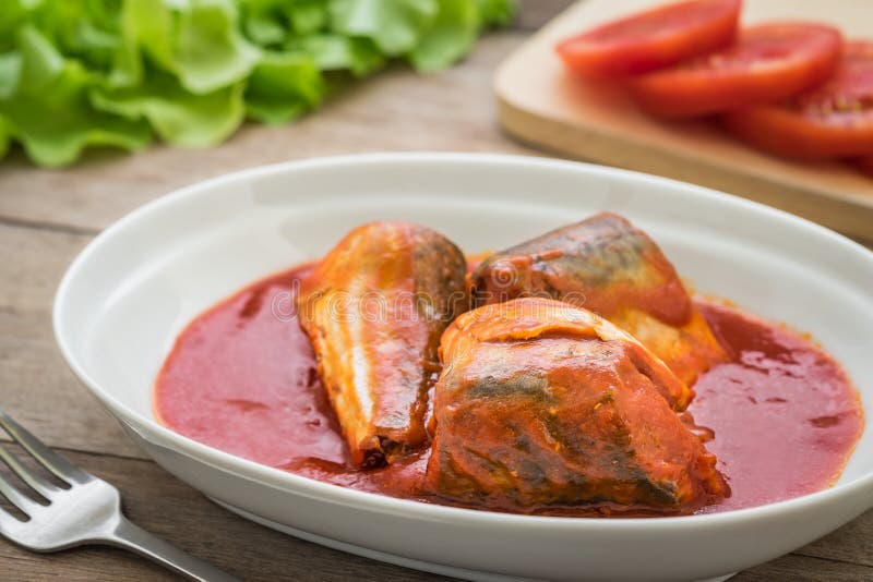 Canned Fish in Tomato Sauce on Plate Stock Photo - Image of lettuce ...