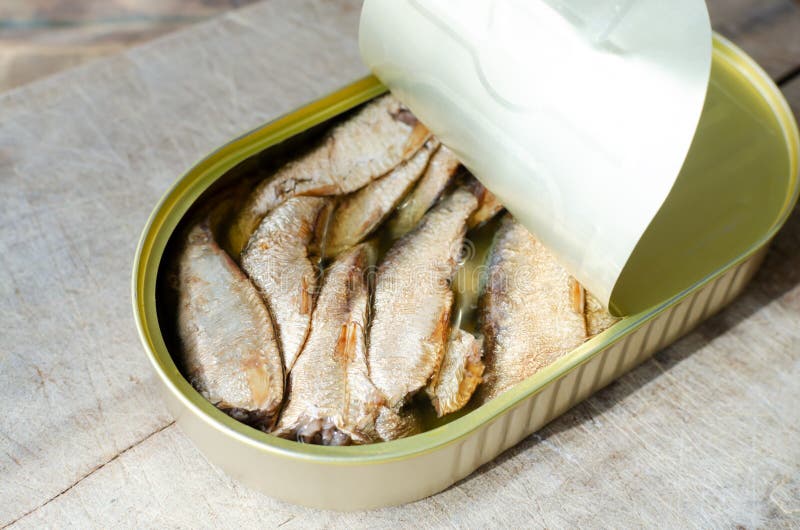 Canned Fish on a Wooden Table. Tinned Fish Concept. Rustic Style Stock ...