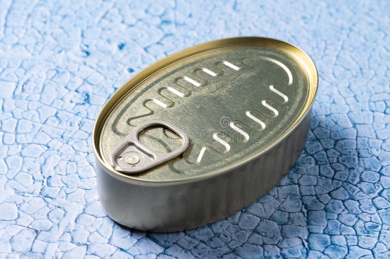 Closed Canned Food in Metal Can on Blue Background Stock Image - Image ...