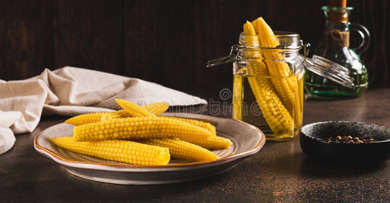 Canned Mini Corn Cobs on a Plate on a Table Web Banner Stock Photo ...