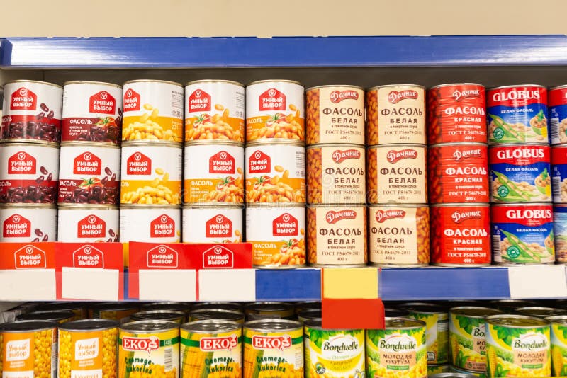 Canned Peas and Canned Corn on the Shelf in the Store Editorial Stock ...
