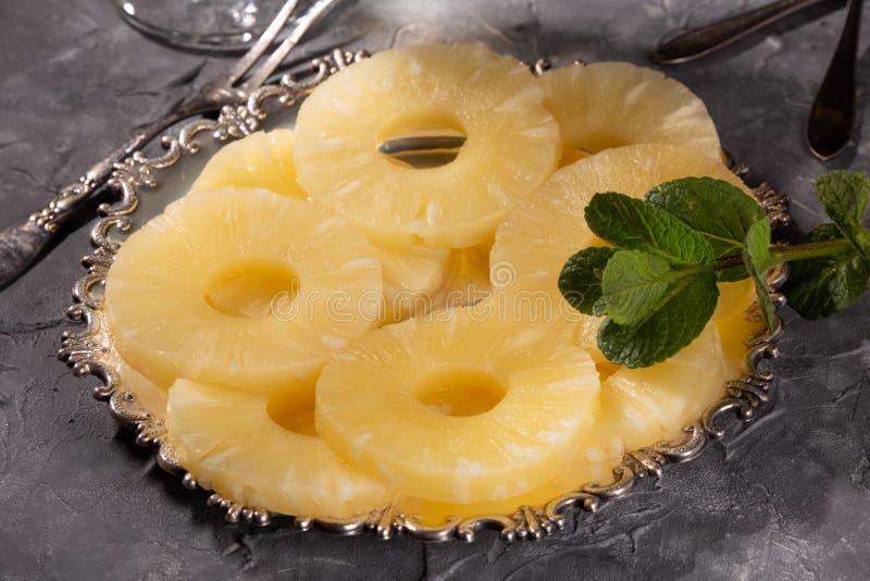 Canned Pineapple, Cut into Rings on a Metal Plate Stock Image - Image ...