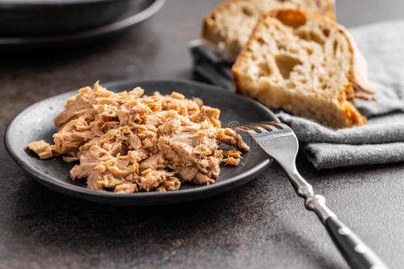 Canned Tuna Fish on the Plate on Black Table Stock Photo - Image of ...