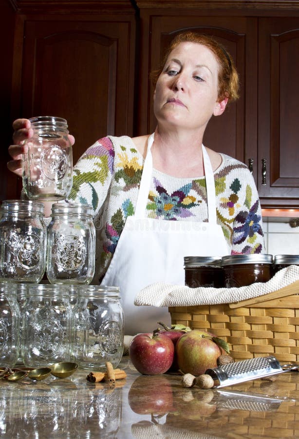 Woman with home canning stock image. Image of female - 33784085