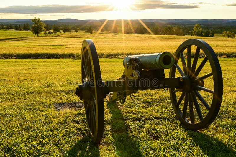 A Cannon Overlooking Field with Shadows at Golden Hour Stock Image ...