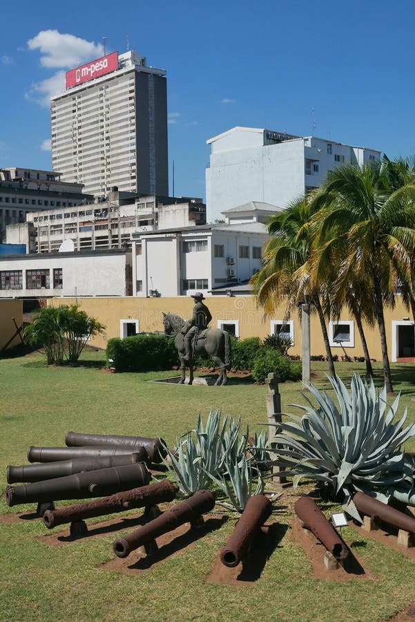 Cannons and Statues Surrounded by Skyscrapers at Fort Maputo Editorial ...