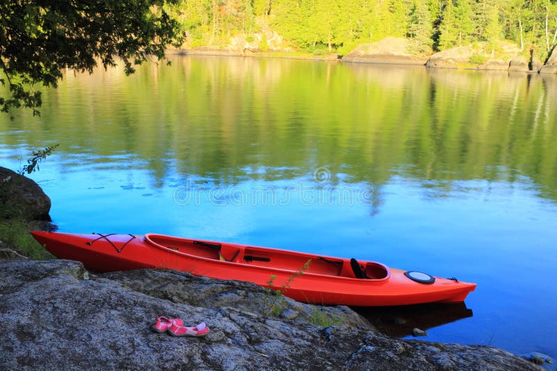 Canoe at the lake stock photo. Image of pond, evening - 22669894