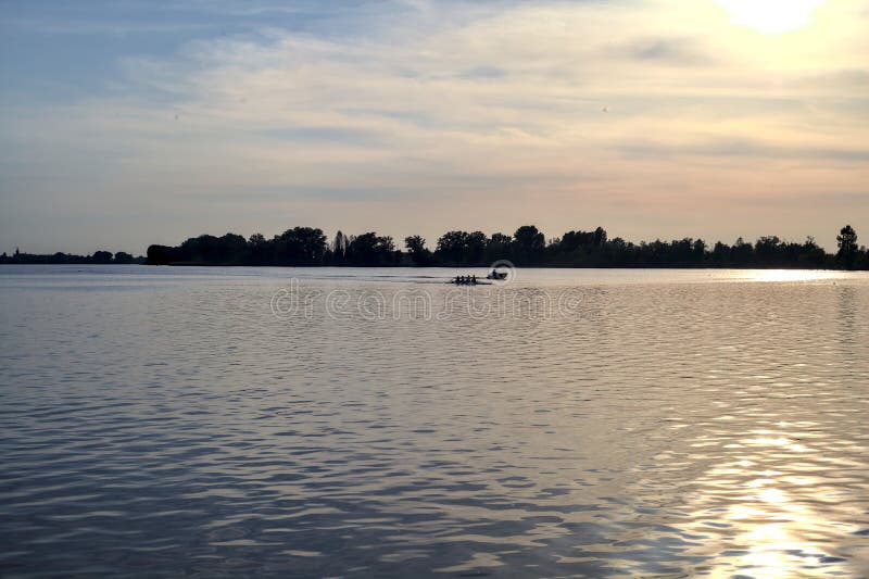 Canoe on a Lake Seen from the Distance Stock Photo - Image of gold ...