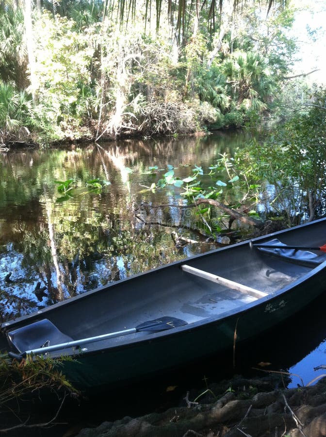 Canoe on River stock photo. Image of trees, plants, green - 48433796