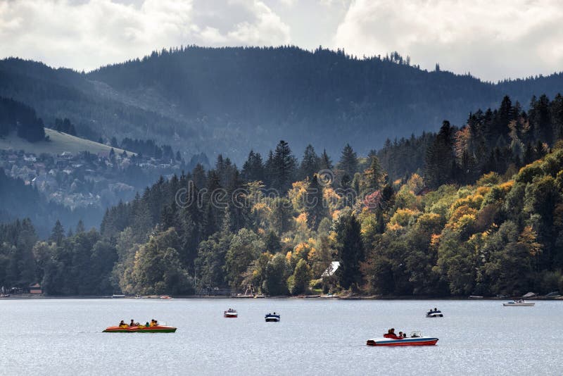 Canoe and Speedboat on Lake Editorial Photography - Image of black ...