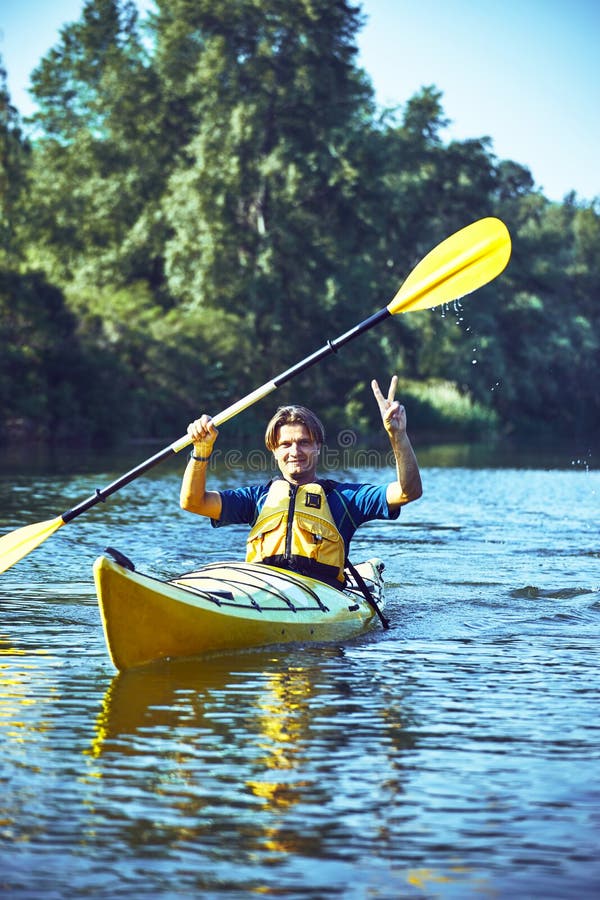 A Canoe Trip Along the River Along the Forest in Summer. Stock Image ...