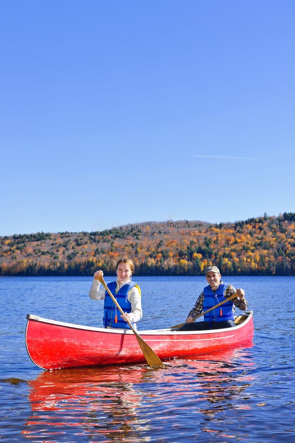 Canoe Trip on Scenic Lake in Fall Stock Image - Image of lake, daughter ...