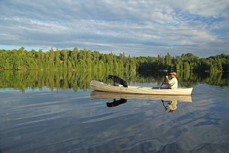 Canoeist with Labrador Retriever in the Bow Stock Image - Image of ...