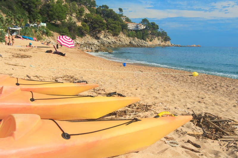Canoes at the beach stock photo. Image of canoes, beach - 81517284