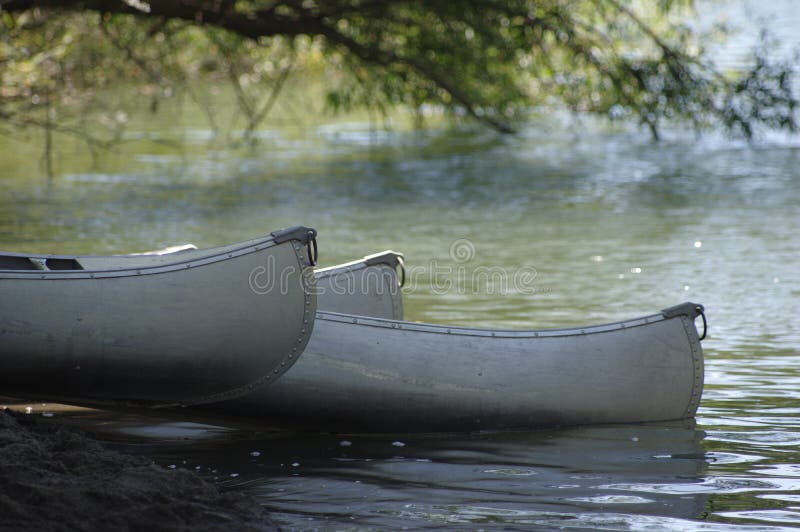 Canoes on the river stock photo. Image of travel, rivets - 55285094