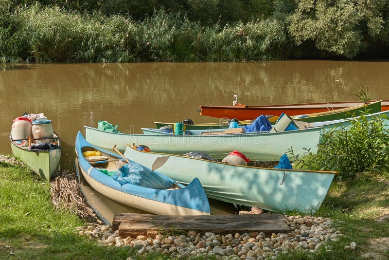 Canoes on the Riverside stock image. Image of calm, activity - 114664091