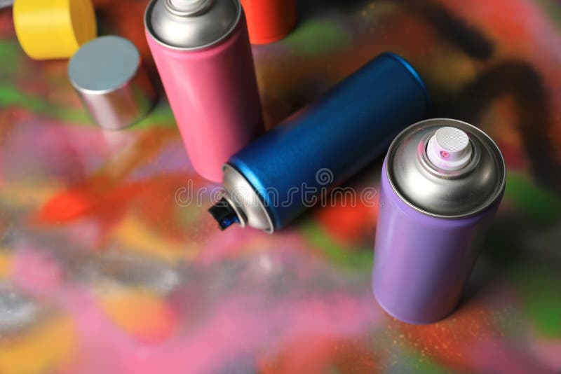 Cans of Different Graffiti Spray Paints on Color Background, Above View ...