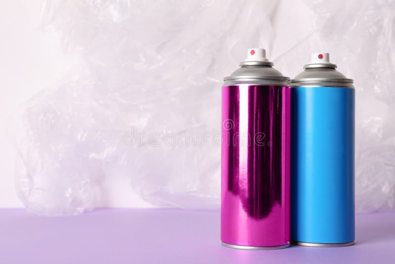 Cans of Different Spray Paints on Color Background Stock Image - Image ...