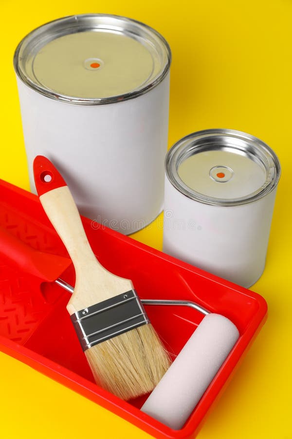 Cans of Orange Paint, Brush, Roller and Container on Yellow Background ...