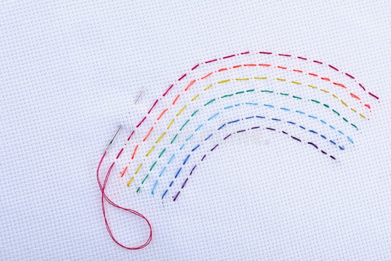 Canvas with Embroidered Rainbow and Needle, Top View Stock Photo ...