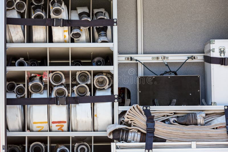 Canvas Hoses Folded Up in Side of a Fire Truck Stock Image - Image of ...