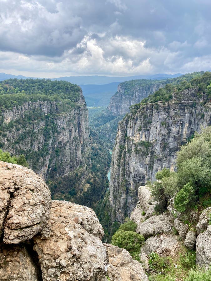 A Canyon Mountain with Trees and River in the Distance between Cliffs ...