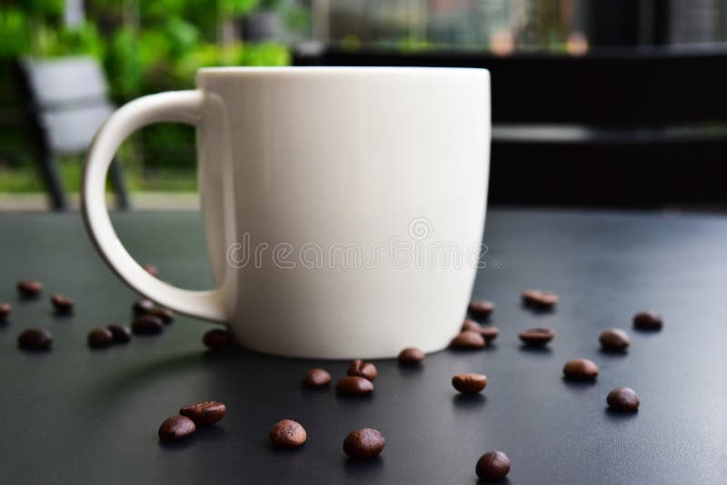 Cap of Coffee on the of Dark Wood Table Have Many Coffee Beans Stock ...