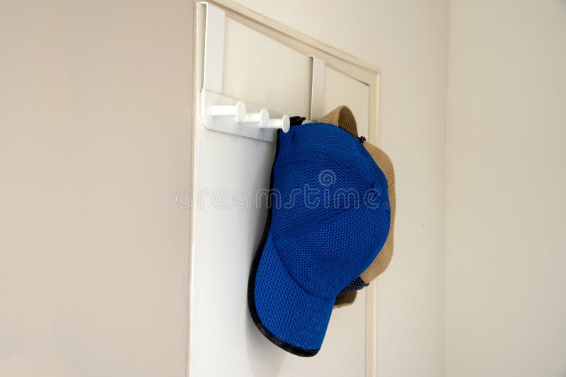 Cap and hat hang on wall stock image. Image of black - 92735517