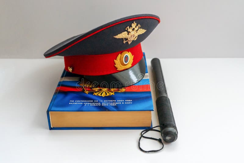 The Cap of a Russian Police Officer and a Rubber Baton is on the Code ...
