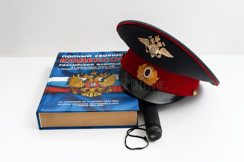 The Cap of a Russian Police Officer and a Rubber Baton is on the Code ...