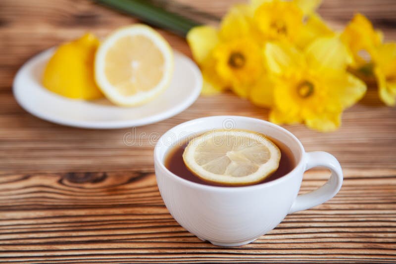 Cap of Tea with Lemon and Flowers on the Wooden Table Stock Photo ...
