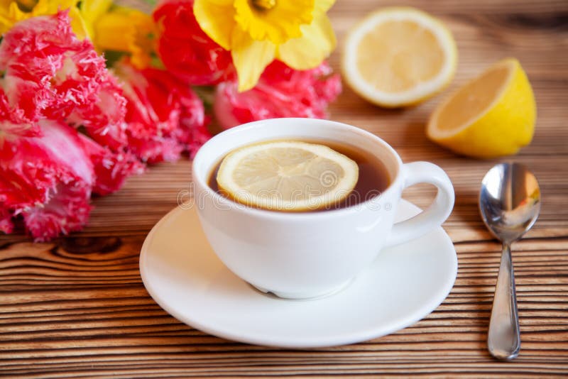 Cap of Tea with Lemon and Flowers on the Wooden Table Stock Photo ...