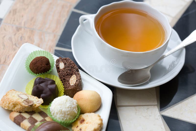 Cap of Tea and Sweets Plate Stock Image - Image of cholesterol, cafe ...