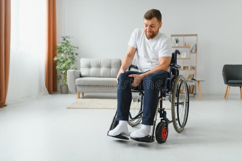 Capable Disabled Trying To Get Up from the Wheelchair. Stock Photo ...