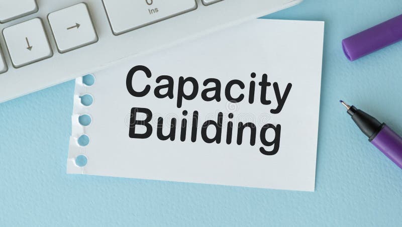 Capacity Building, Text with White Paper on White Keyboard on Blue ...