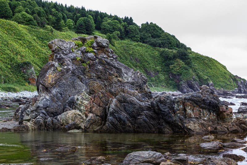 Mys Ostry. South Sakhalin, Russia Stock Photo - Image of clouds, rocks ...