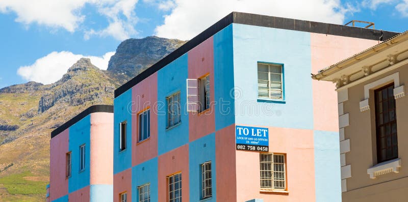 Colourful Old Block of Flats in City with Mountain in the Background ... Colourful Old Block of Flats in City with Mountain in the Background ...